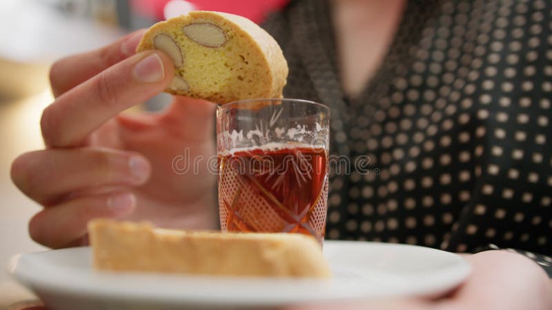 A Womans Hand Dips Biscuits into Typical Indian Tea Stock Video - Video ...