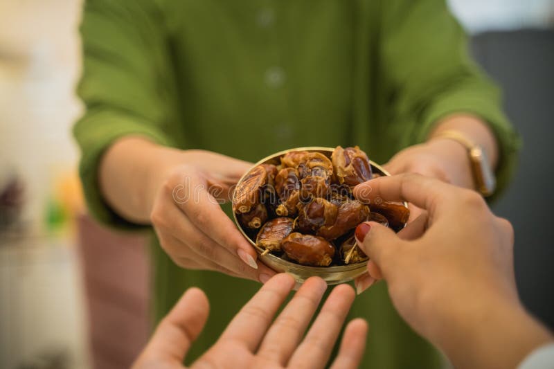 Womans Hand Serves a Bowl of Dates for Iftar Stock Photo - Image of ...