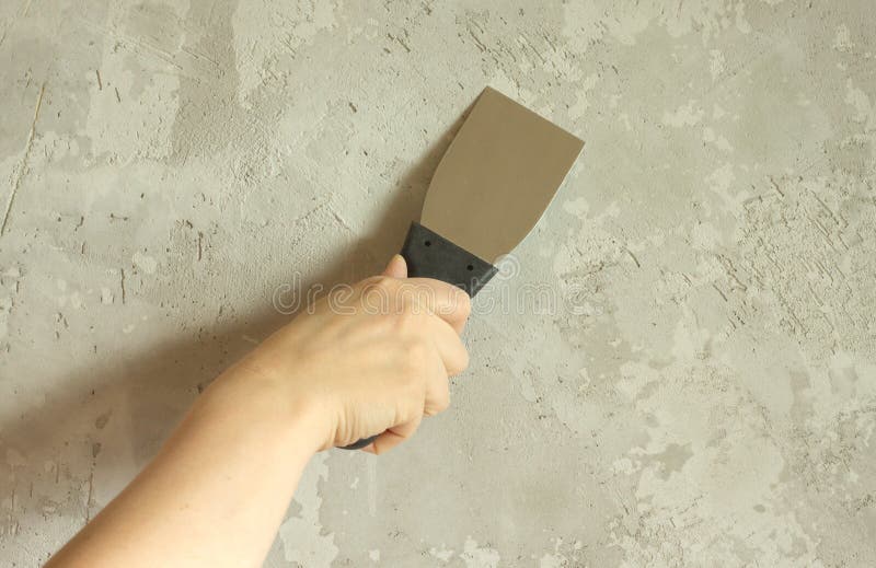 Womans Hand with a Spatula Plasters Wall Stock Photo - Image of ...