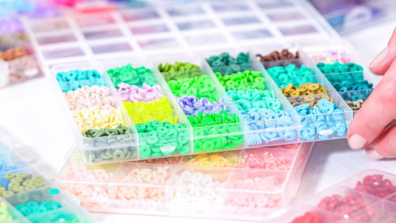 Womans Hands Amidst a Rainbow Array of Beads for Jewelry Crafting Stock ...