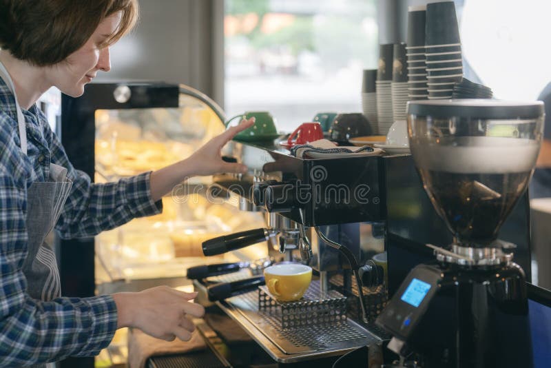Women Barista in an Apron Making Coffee in a Coffee Shop Stock Photo ...