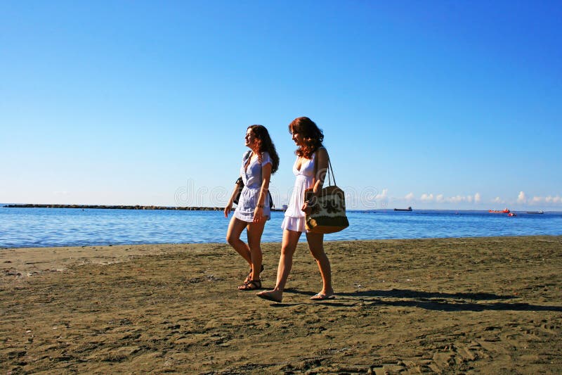 Women on beach stock image. Image of ocean, jump, female - 29313269