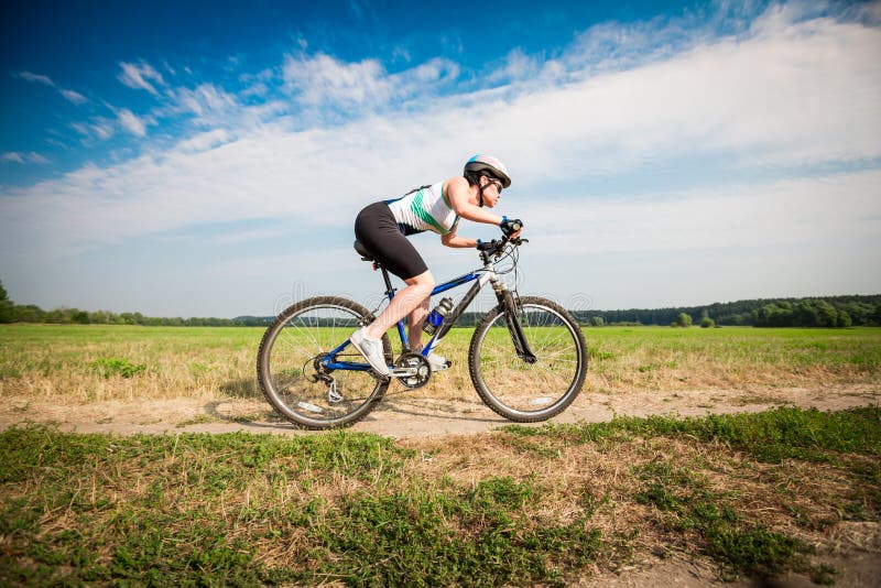 Women on bike stock image. Image of bicycle, action, green - 43333155