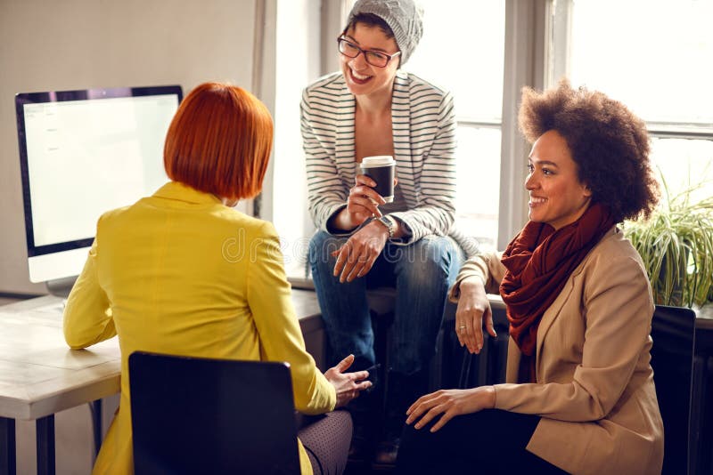 Women on break in company stock photo. Image of afro - 130580574