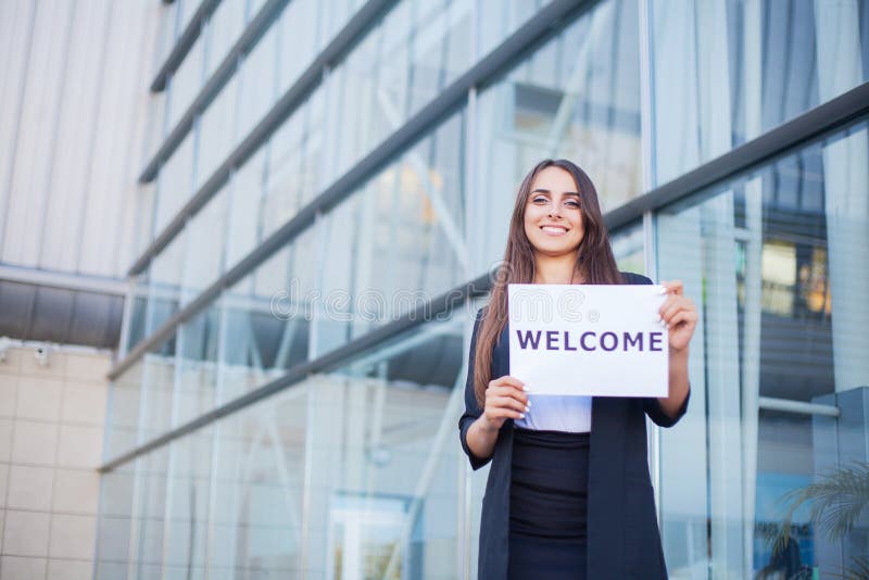 Women Business with the Poster with Welcome Message Stock Image - Image ...