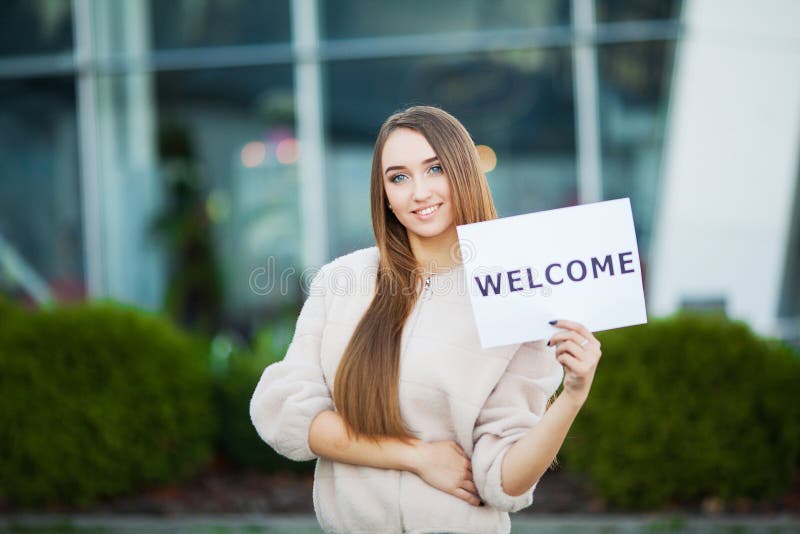 Women Business with the Poster with Welcome Message Stock Image - Image ...