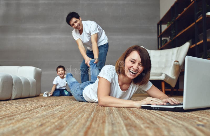 A Woman Cannot Tear Herself Away from the Computer. Dad and Son Drag ...