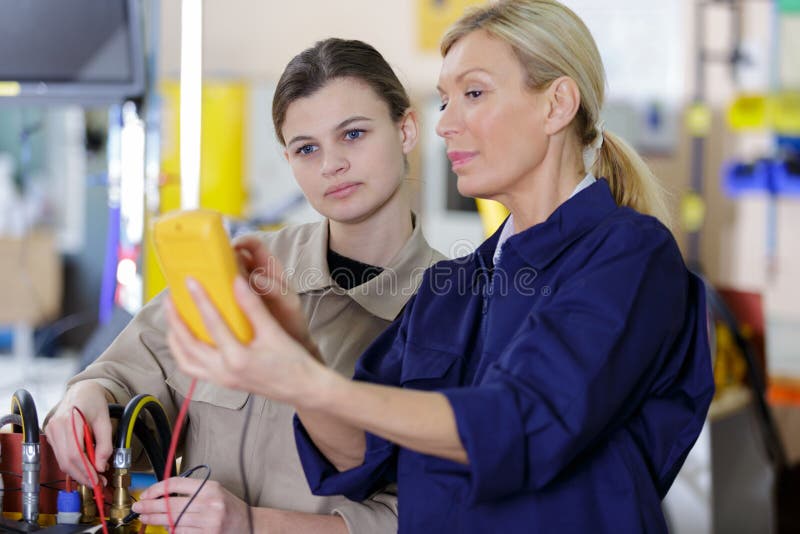 Women Checking Voltage Machine Stock Photo - Image of skill, fixing ...