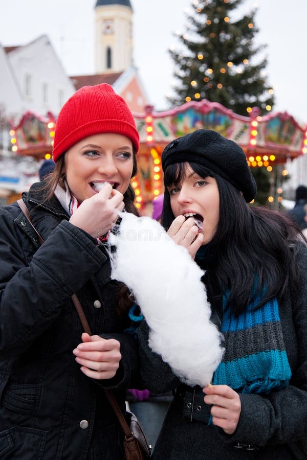 Women on Christmas Market Eating Candy Stock Image - Image of women ...