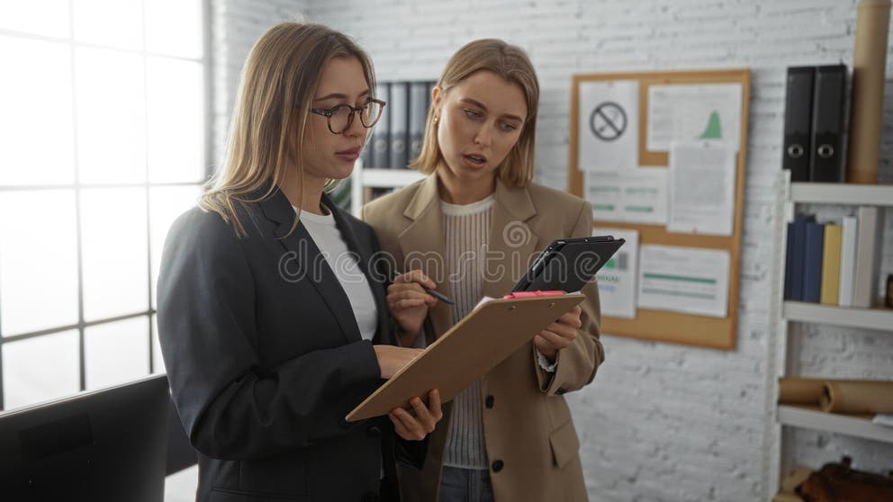 Women Collaborating in a Modern Office Environment, Focused on a ...