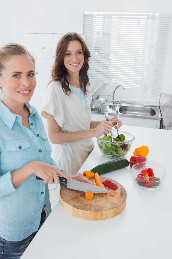 Women Cooking Together and Looking at Camera Stock Photo - Image of ...