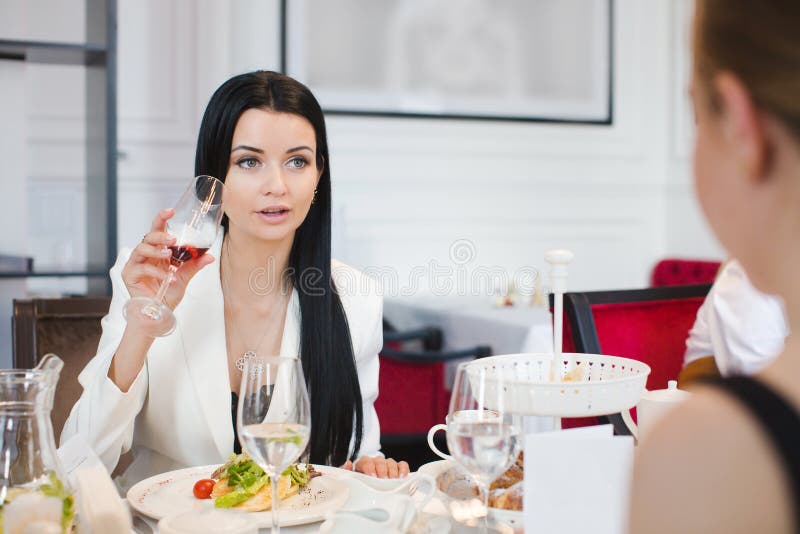 Women dining in restaurant stock image. Image of luxury - 94306469