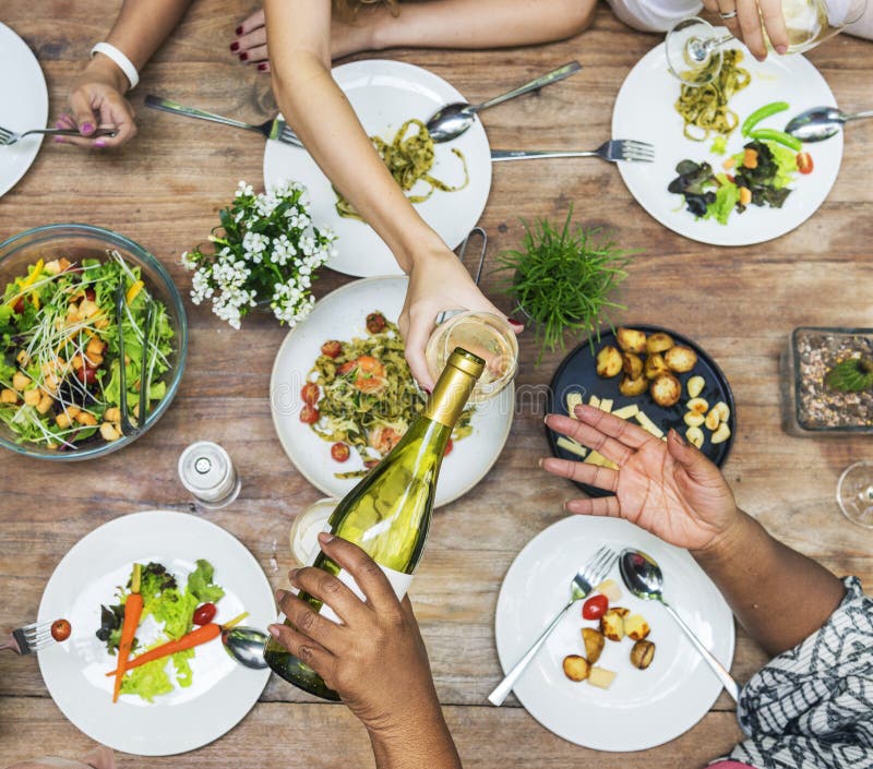 Women at a dinner party stock photo. Image of group - 102598044