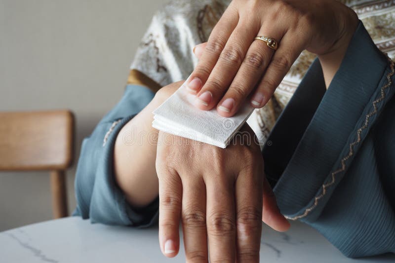 Women Disinfecting His Hands with a Wet Wipe. Stock Photo - Image of ...