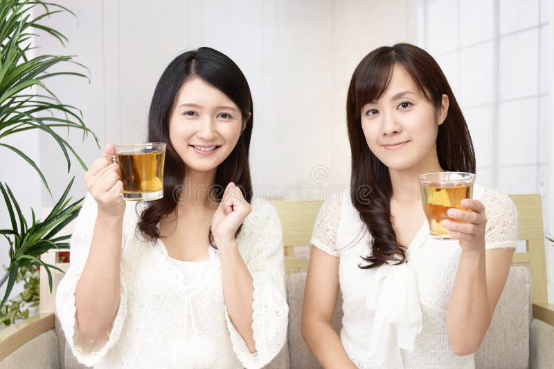 Women drinking tea stock photo. Image of cozy, enjoys - 109816280