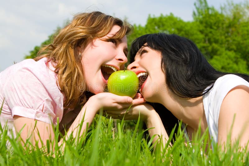 Women Eating Apple on the Summer Glade Stock Photo - Image of cheerful ...