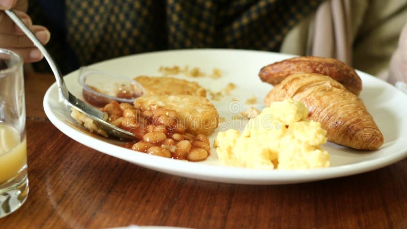 Women Eating Baked Beans and Eggs on Plate Stock Footage - Video of ...