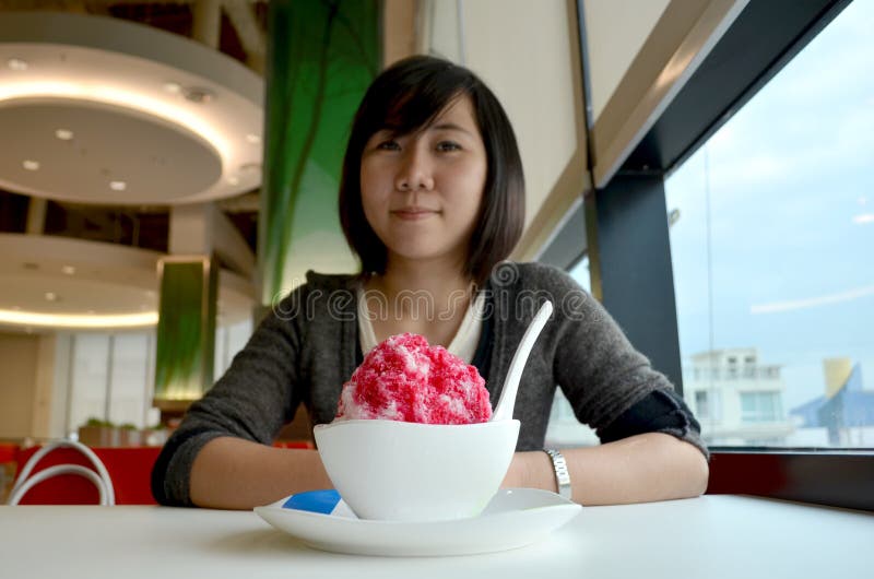 Women eating shaved ice stock photo. Image of syrup, cold - 25458734