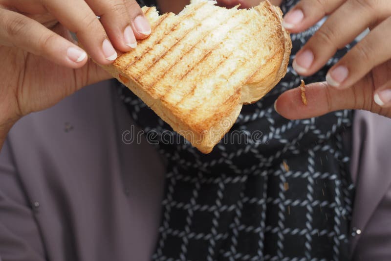 Women Eating Toasted Sandwich with Ham and Cheese, Stock Image - Image ...