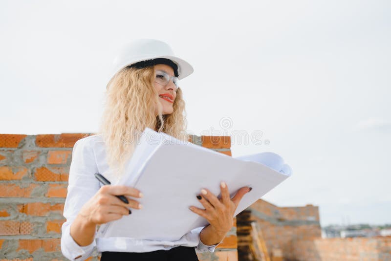 Women Engineer Look at Building Glass. Stock Photo - Image of ...