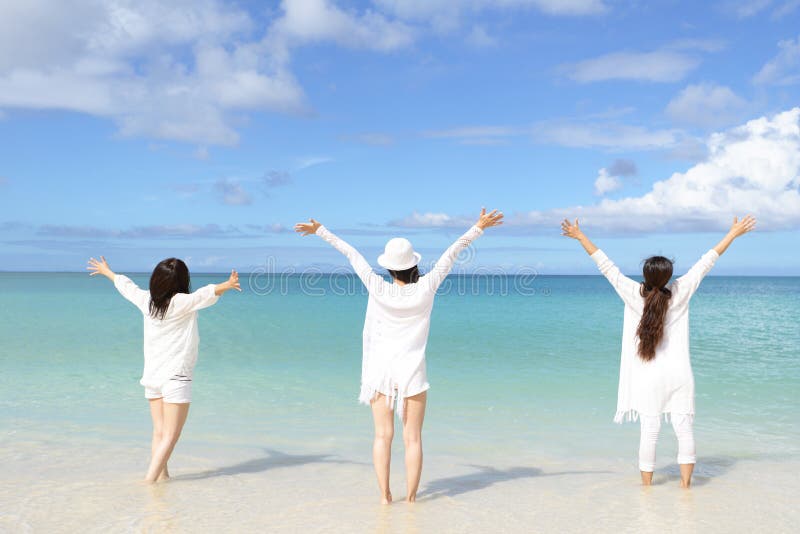 Women enjoy the sun stock image. Image of japan, coast - 112477435