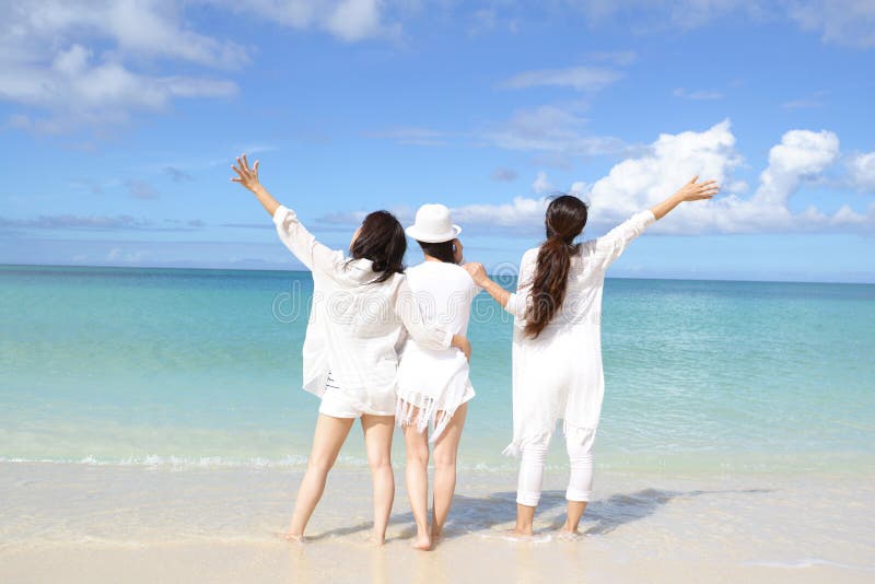 Women enjoy the sun stock photo. Image of pacific, beach - 112477466