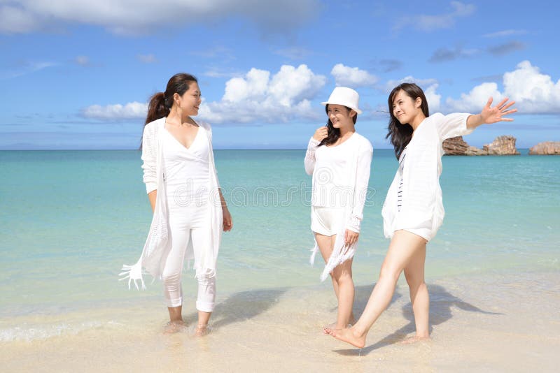 Women enjoy the sun stock photo. Image of pacific, friend - 112477060