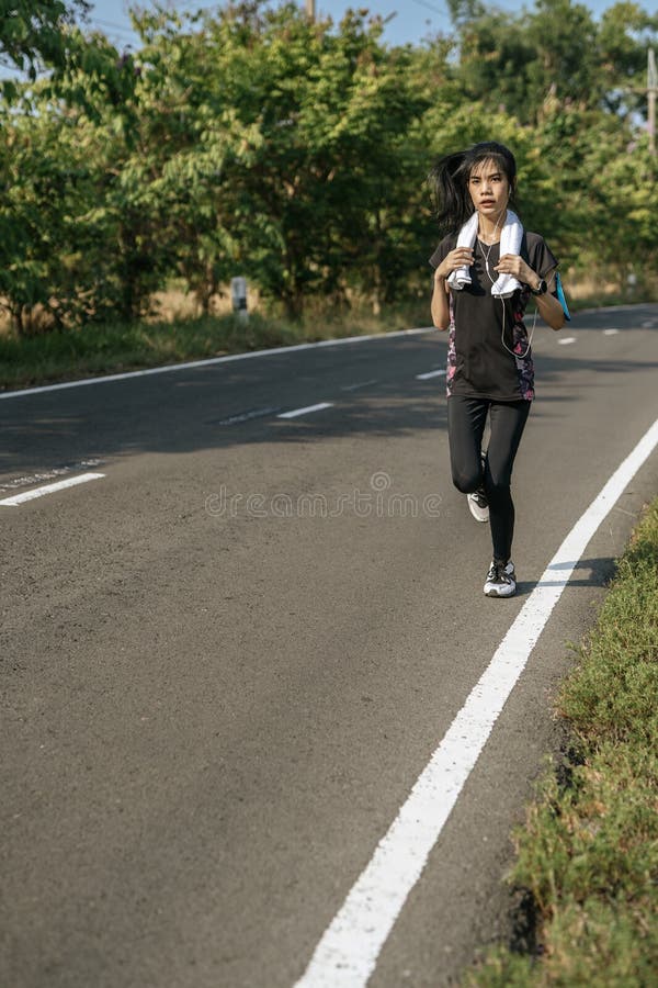 Women Exercise by Running on the Road Stock Photo - Image of jogger ...