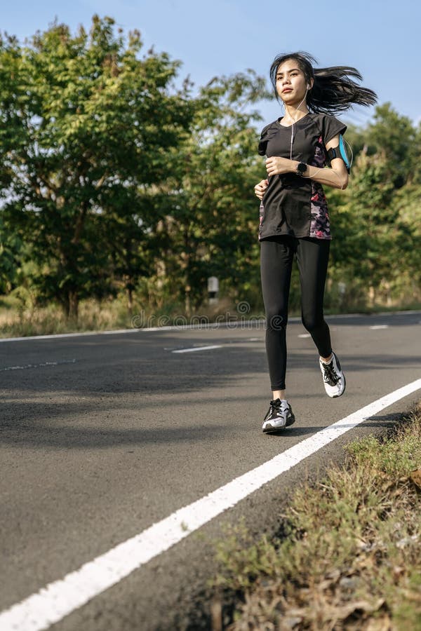 Women Exercise by Running on the Road Stock Photo - Image of practicing ...