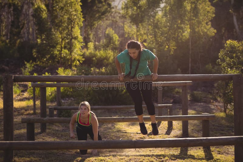 Women Exercising on Outdoor Equipment during Obstacle Course Stock ...