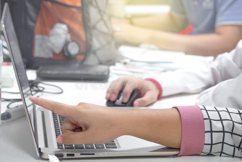 Women Explain Work on Laptop To Business Man in Modern Office Stock ...
