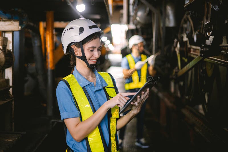 Female Engineer and Worker Checking Equipment in Factory for Repair ...