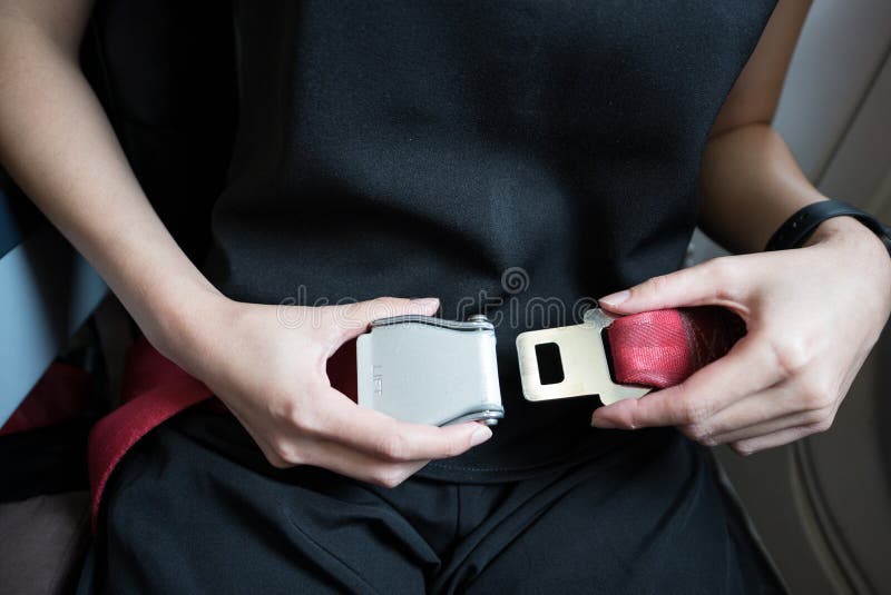 The women fasten seat belt stock image. Image of transport - 104055319