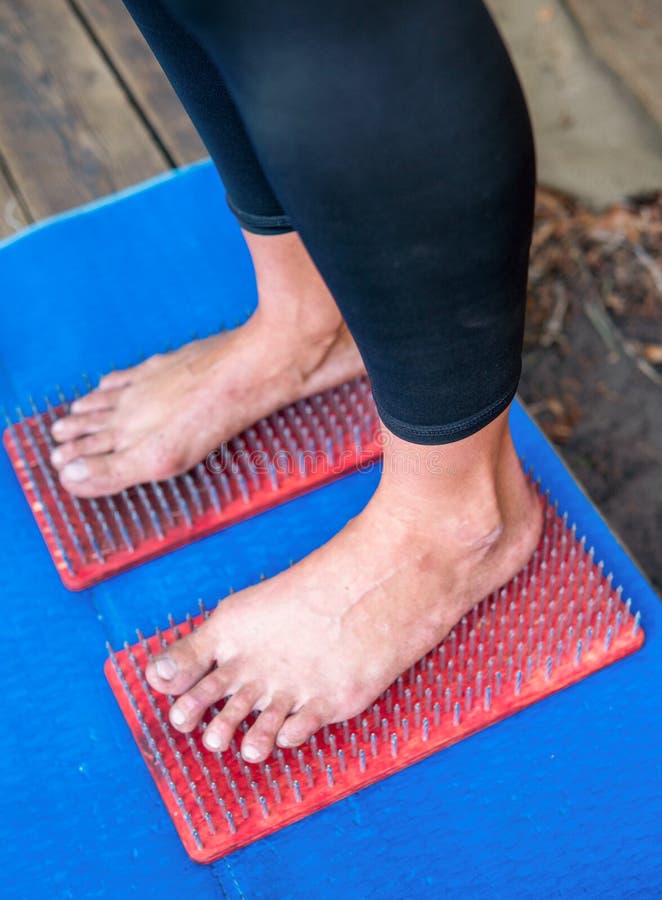 Women Feet are Standing on a Board with Sharp Nails, Sadhu Board Stock ...