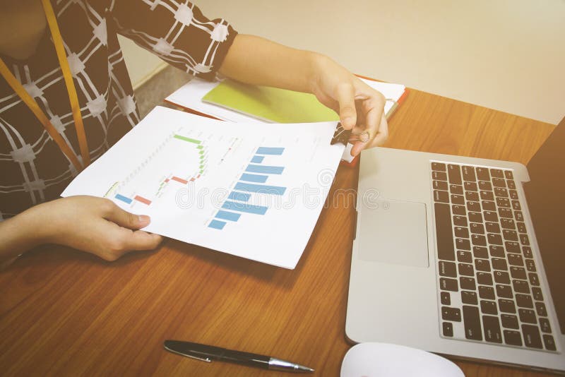 Women are Gathering Documents by Clip Clips and Using Computers in the ...