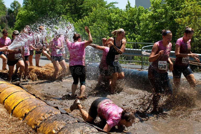 Women Get Sprayed with Fire Hose in Mud Pit Editorial Photo - Image of ...