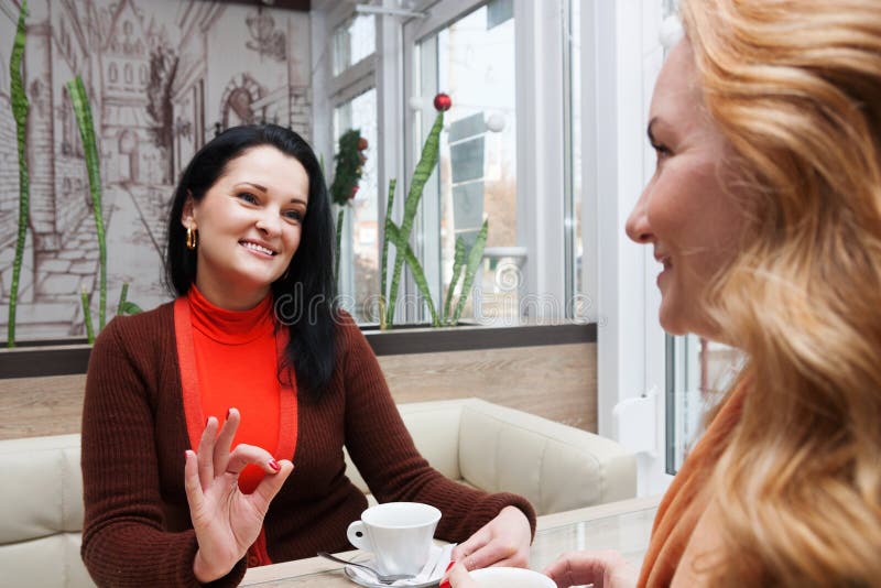 Women gossip in the cafe stock image. Image of gossip - 67808909