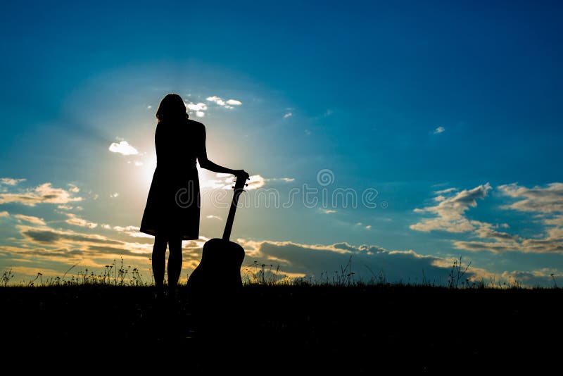Women with Guitar Over Sunset Sky, Stock Photo - Image of sunrise ...