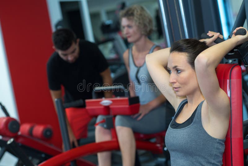 Woman in gym stock image. Image of recreational, move - 232509217