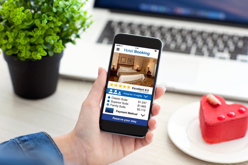 Women Hand Holding Phone with App Hotel Booking Screen Notebook Stock ...