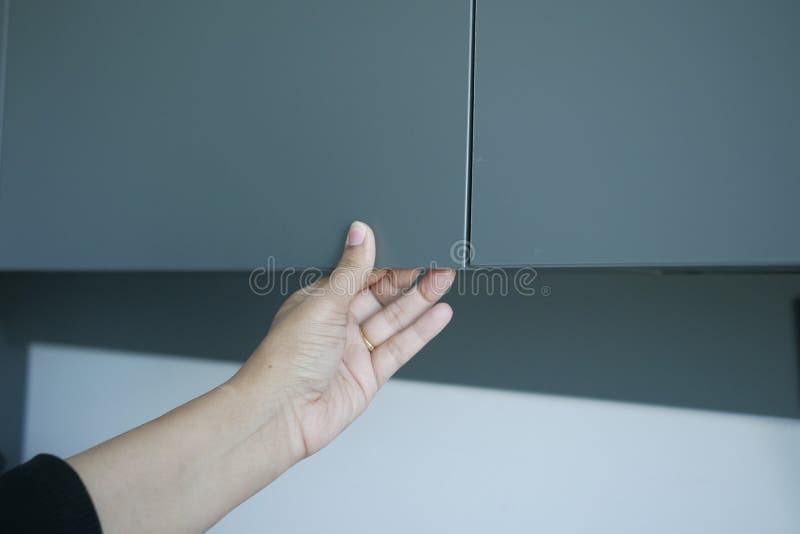 Women Hand Open a Kitchen Cabinet Drawer Stock Photo - Image of ...