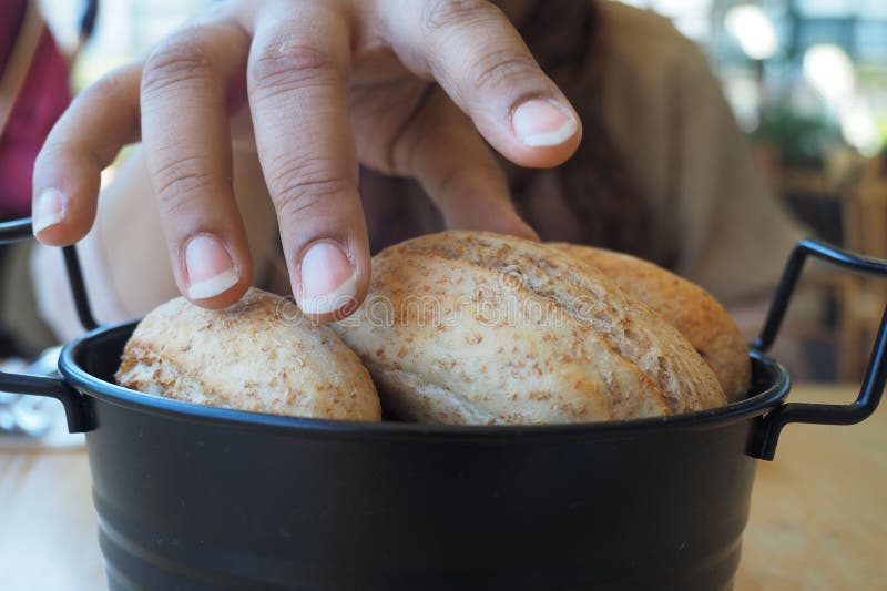 Women Hand Pick Baked Bun on Table Stock Image - Image of sliced, pick ...