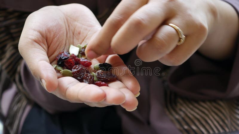 Women Hand Pick Black Raisin Stock Footage - Video of delicious, black ...