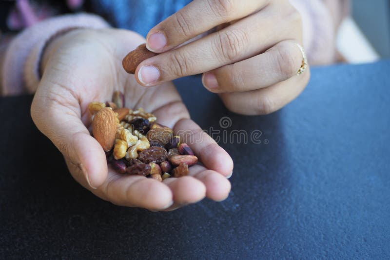 Women hand pick mixed nuts stock photo. Image of healthy - 286467918
