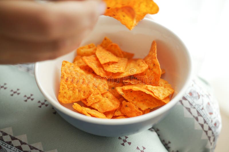 Women Hand Pick Potato Chips from a Bowl Stock Photo - Image of ...