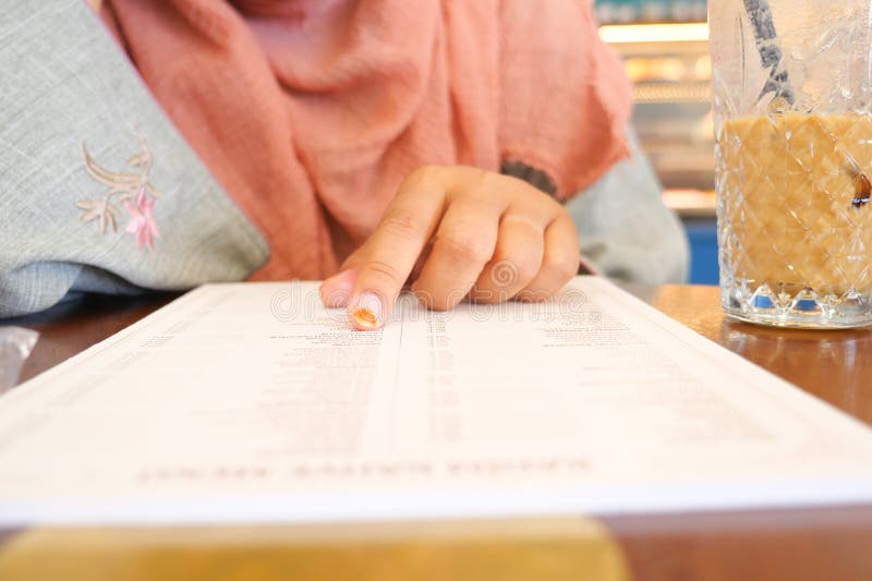 Women Hand Reading a Food Menu at Cafe. Stock Photo - Image of females ...