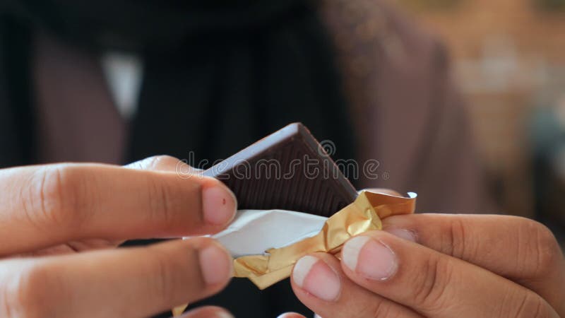 Women Hand Removing Packet from a Chocolate Stock Footage - Video of ...