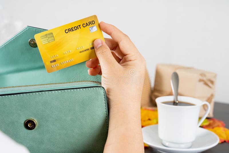 Women Hand Using a Yellow Credit Card, she Pulled the Card Out of Her ...
