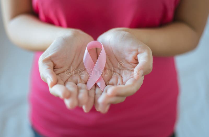 Women Hands Holding Pink Ribbon Breast Cancer Awareness Concept Close