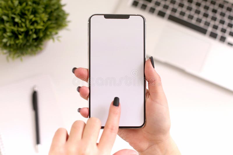 Women Hands Holding the White Phone with Isolated Screen Above the ...